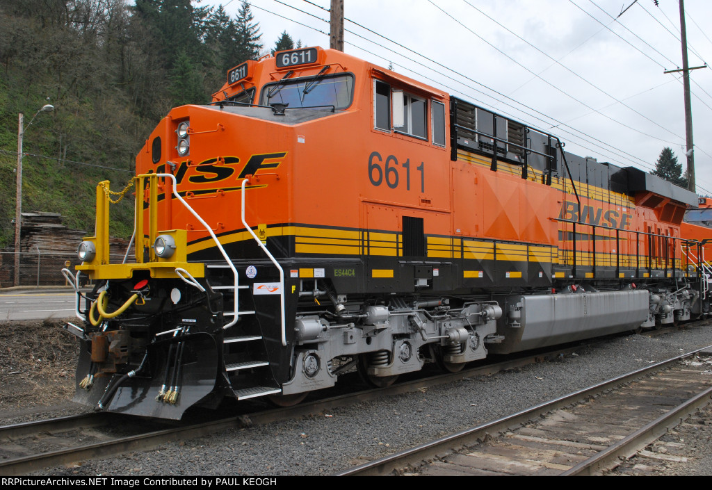 BNSF 6611 waits to Head east as the 3d unit in a consist of 3 Very Brand New ES44C4's on the Z ...